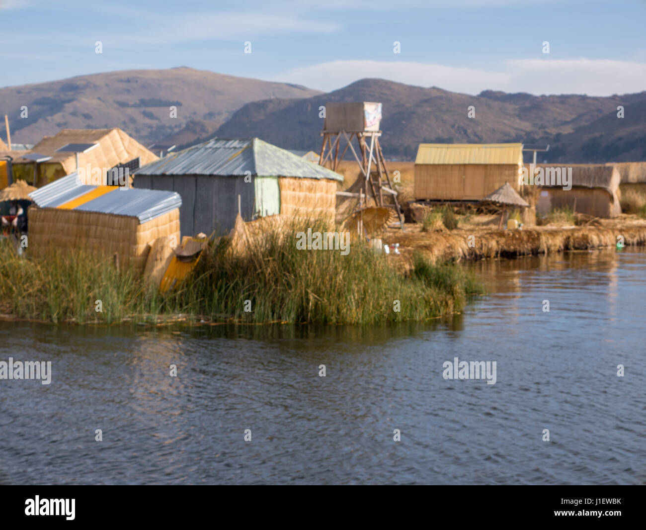 View of the Uros floating reed islands with boats, mysterious Lake ...