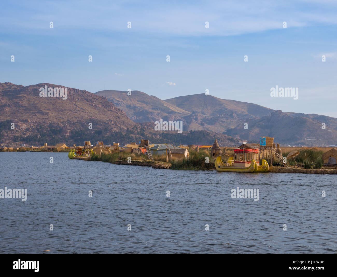 View of the Uros floating reed islands with boats, mysterious Lake ...