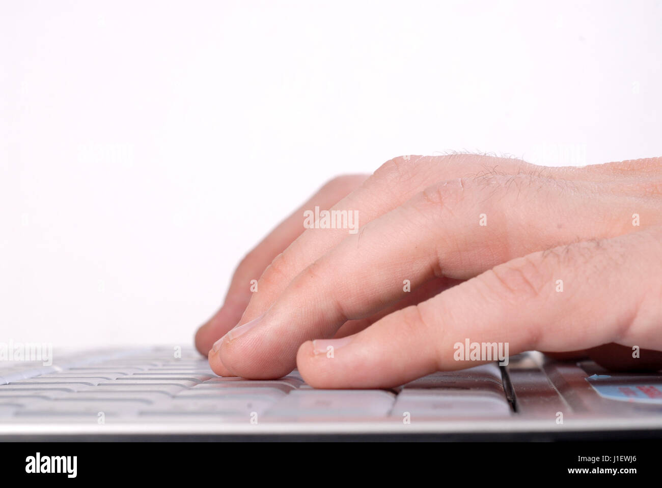 Hand on keyboard on white background Stock Photo - Alamy