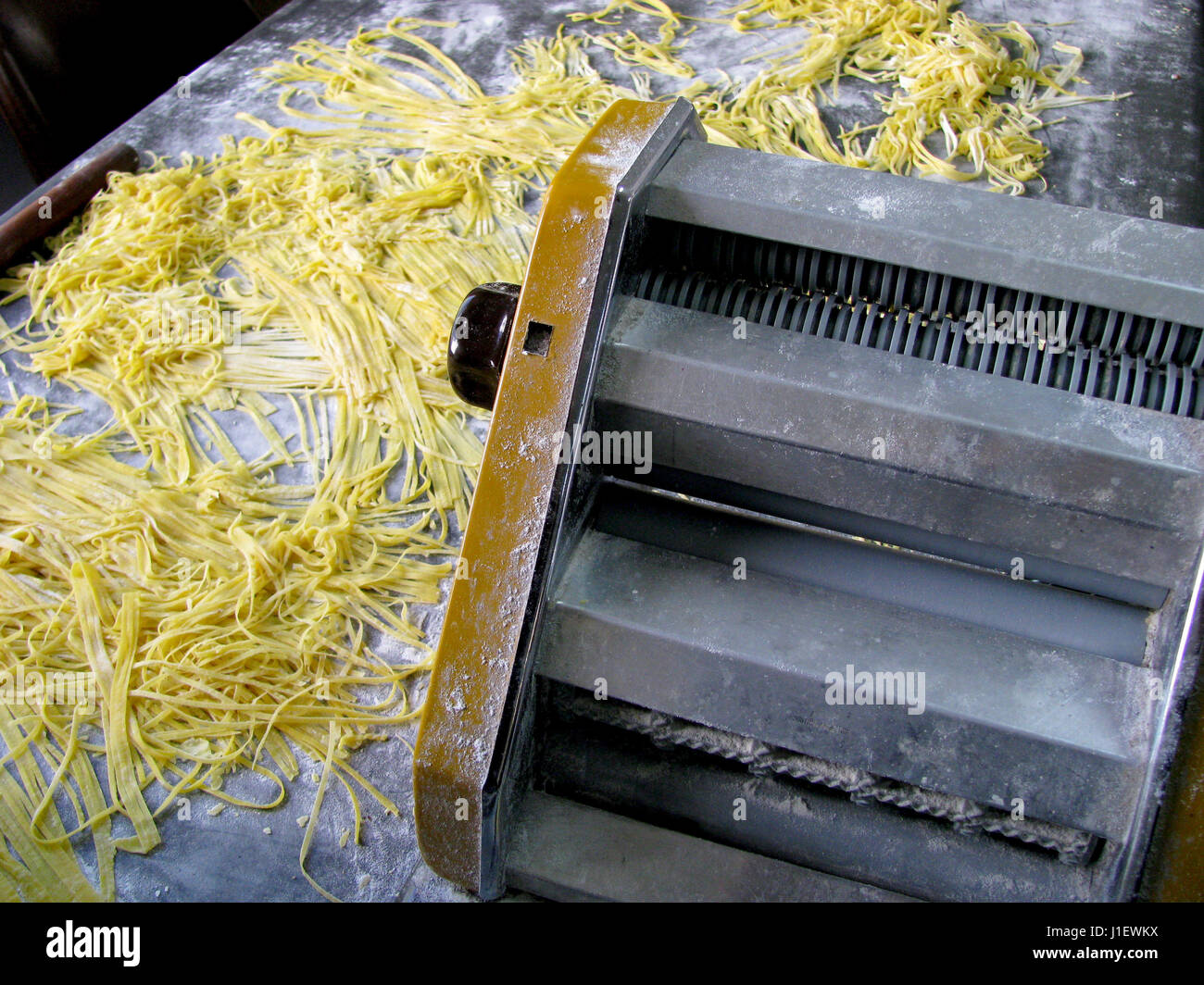 Vintage Metal pasta maker machine with fresh dough Stock Photo - Alamy