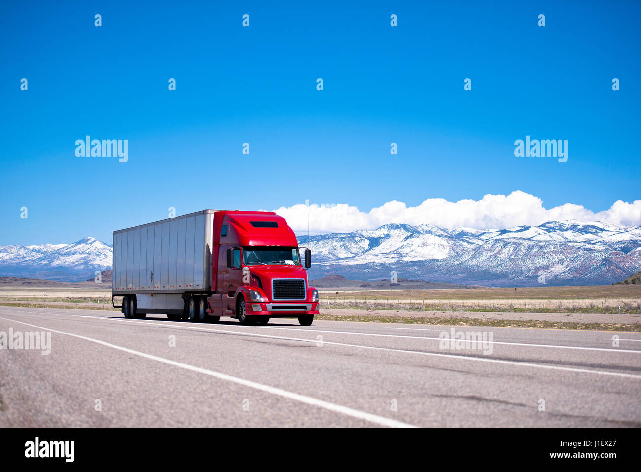 Large beautiful modern classic-modern red truck with a high cab and ...