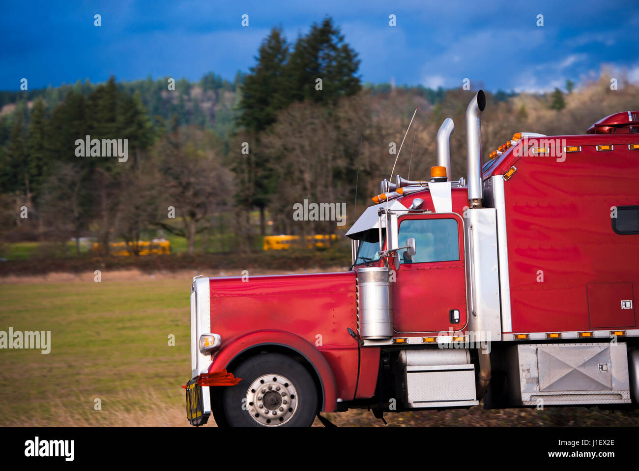 Classic American red big rig semi truck with stainless steel high ...