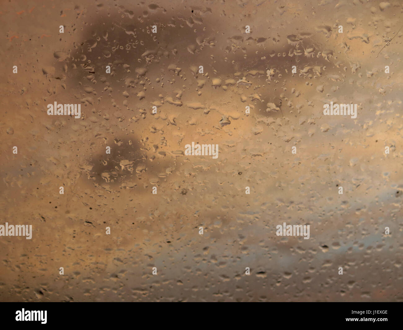 Rain drops over the window at sunset Stock Photo - Alamy
