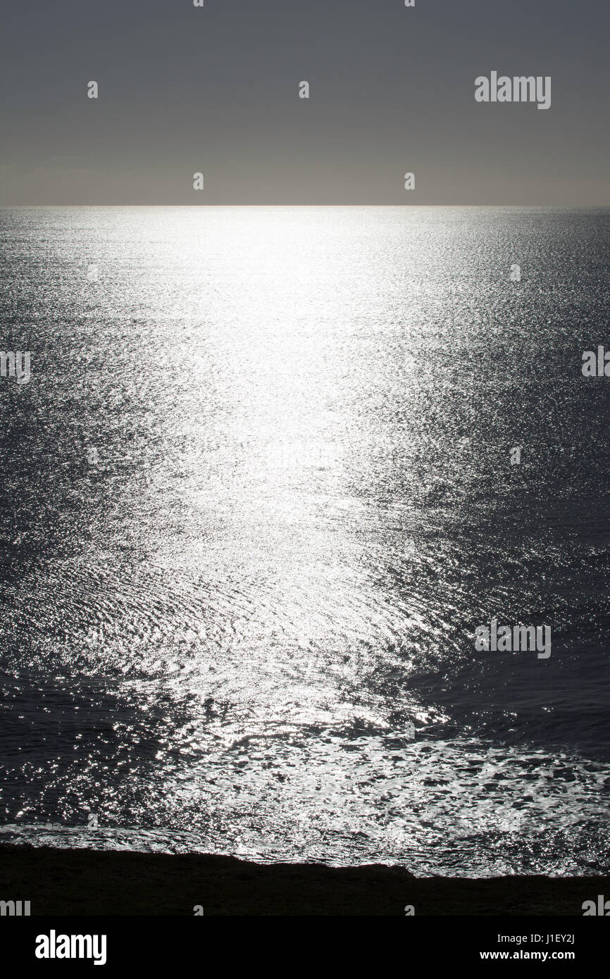 Midday sun in January shining on the sea. Made to look like moonlight ...