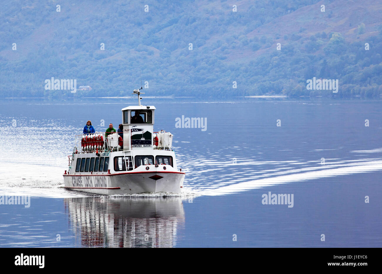 A tour cruise boat on Loch Lomond, Trossachs National Park, Scotland ...