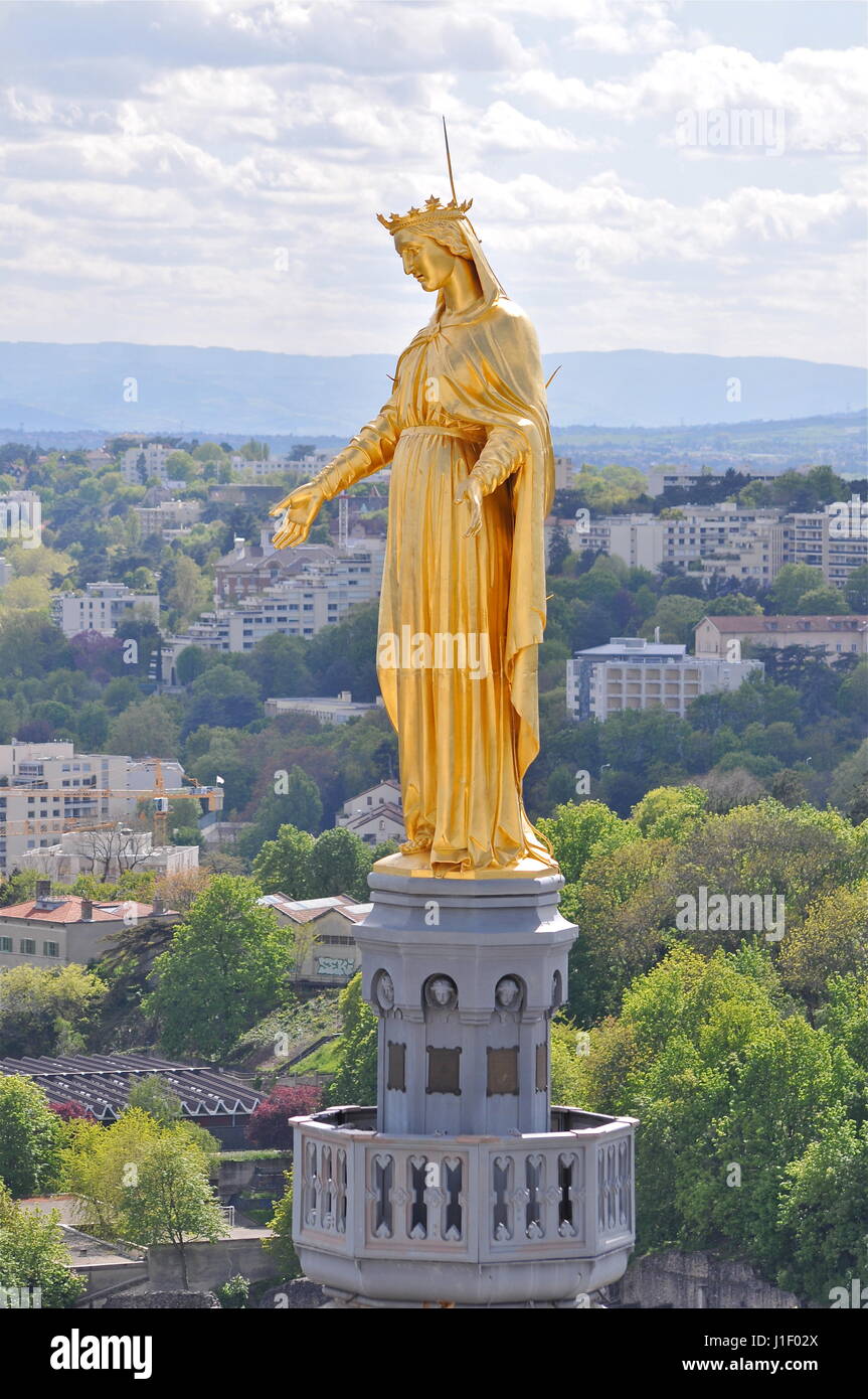 Golden statue of Virgin Mary looks upon Lyon (South-East France) from ...