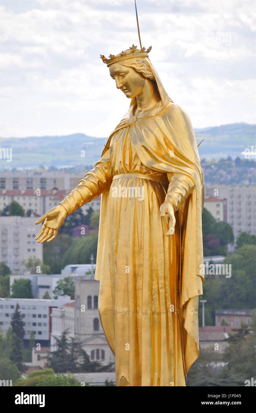 Golden statue of Virgin Mary looks upon Lyon (South-East France) from ...