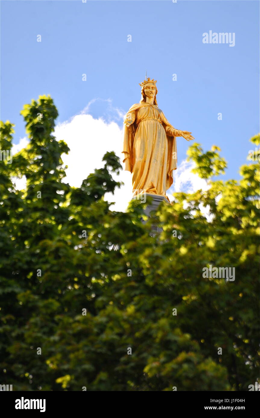 Golden statue of Virgin Mary looks upon Lyon (South-East France) from ...