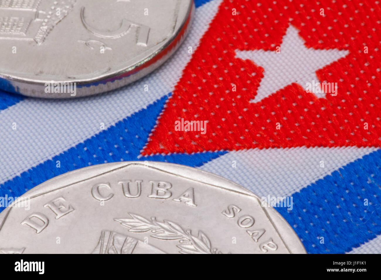 Detail of Cuban coin and flag on the table Stock Photo - Alamy