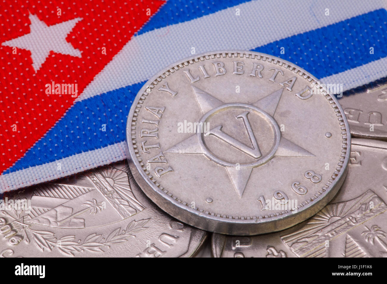 Detail of different Cuban pesos coins on the table Stock Photo - Alamy