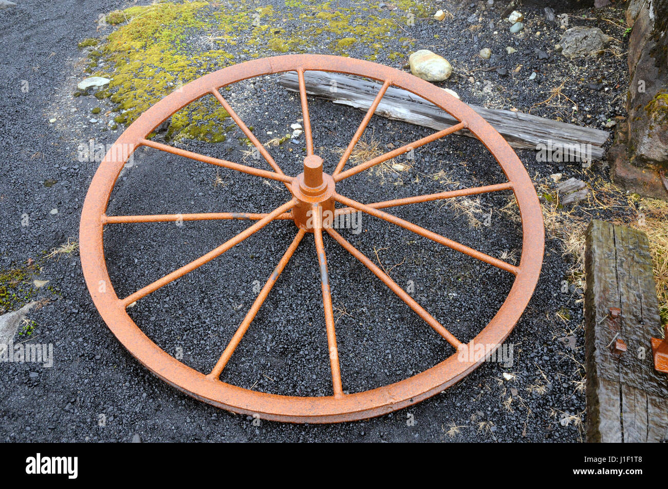 A steel wheel, possibly from a mine winding gear, lies as an exhibit at ...
