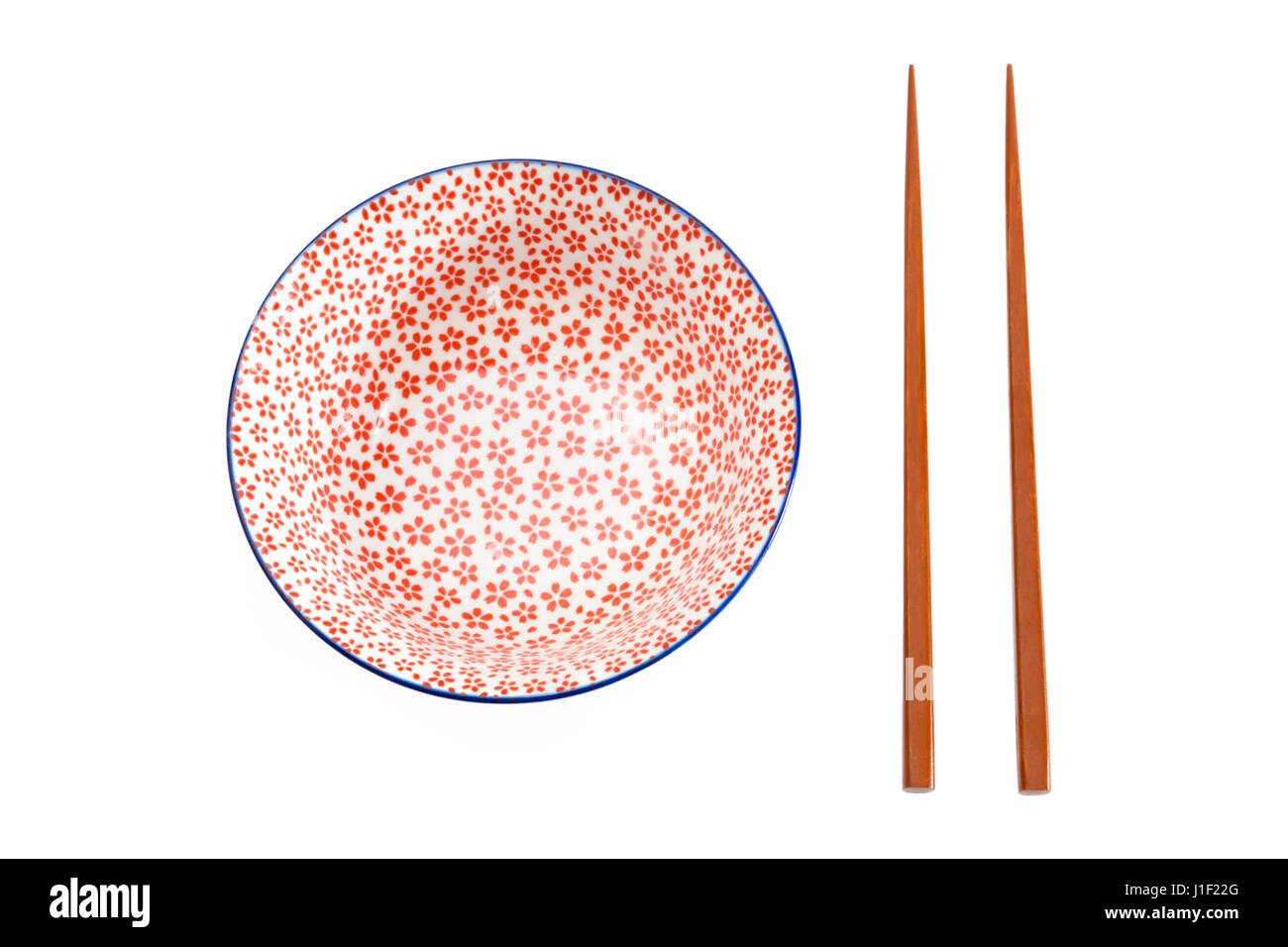 Empty rice bowl with chopsticks viewed from above and isolated on a ...