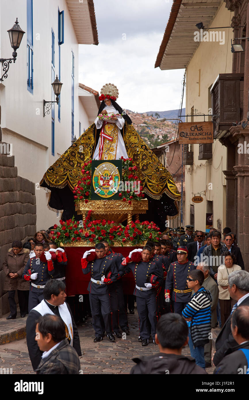 Police in best uniform carry a statue of Saint Rose through the streets ...