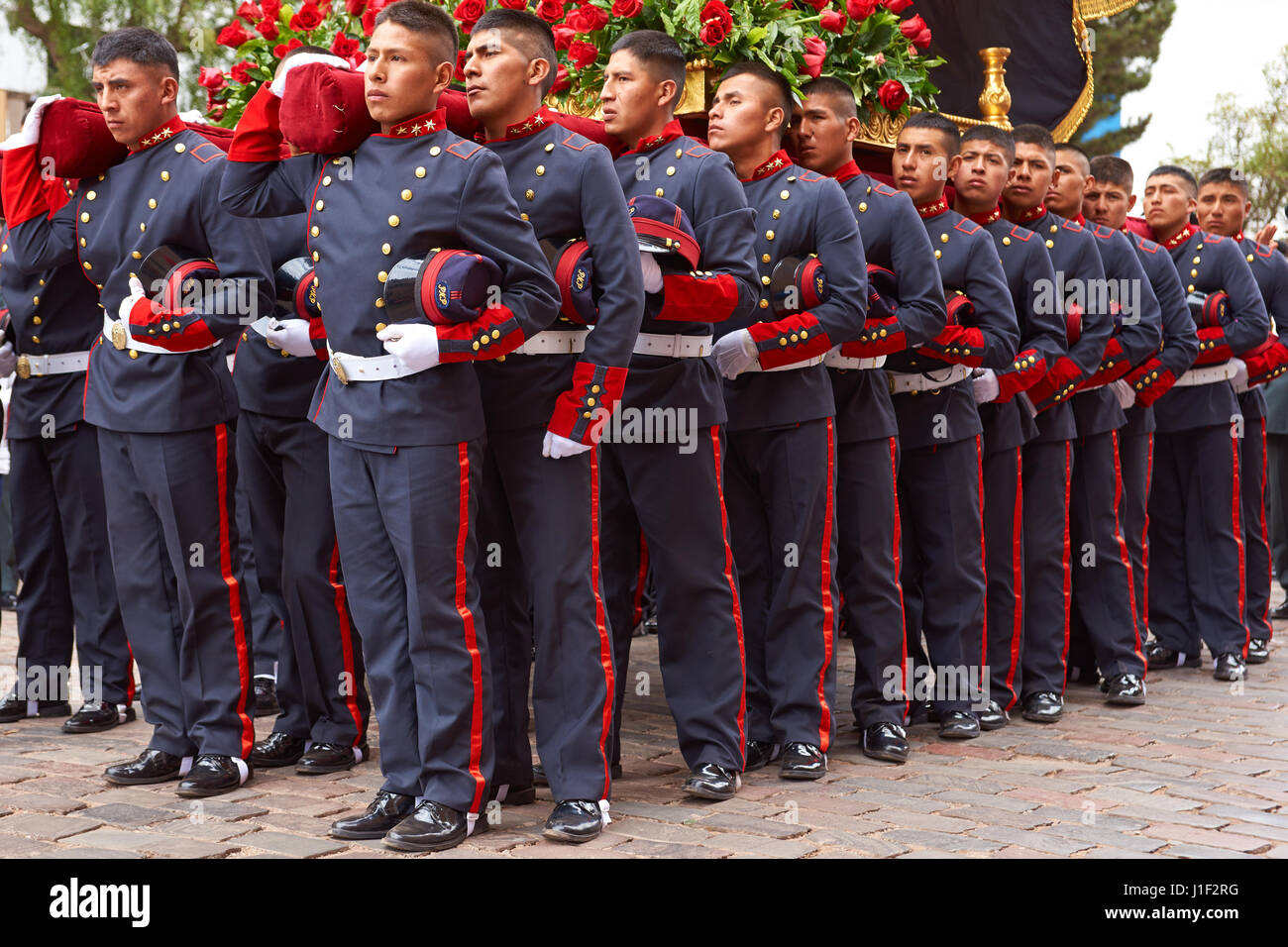 Police in best uniform carry a statue of Saint Rose through the streets ...