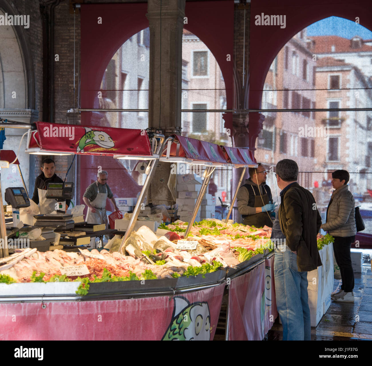 People buying fish in Rialto market, Venice Stock Photo - Alamy