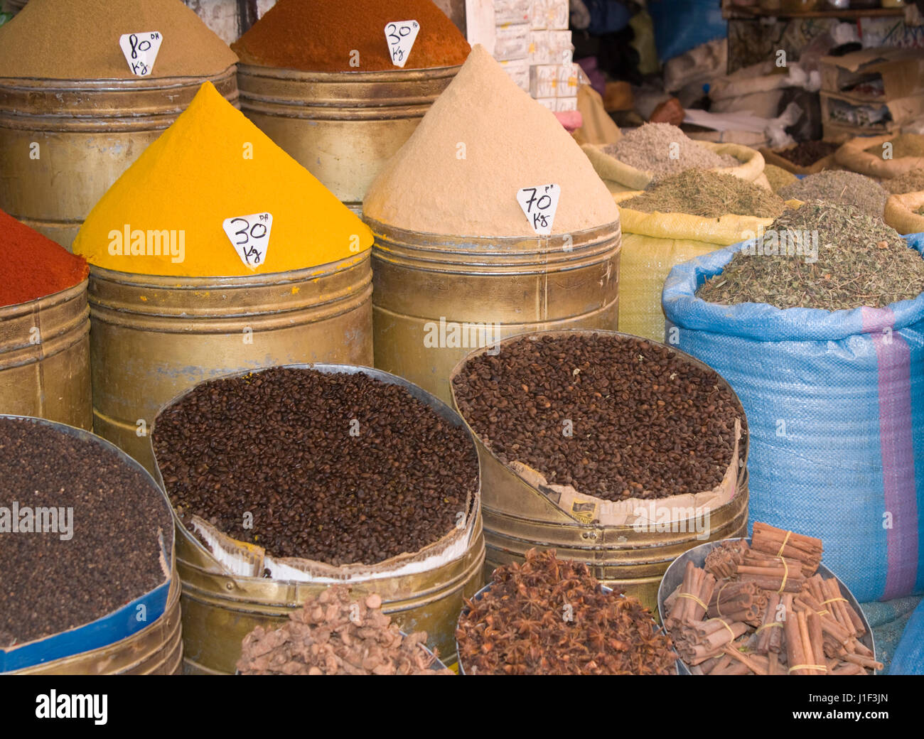 Containers of spices and food ingredients for sale in a shop in the ...