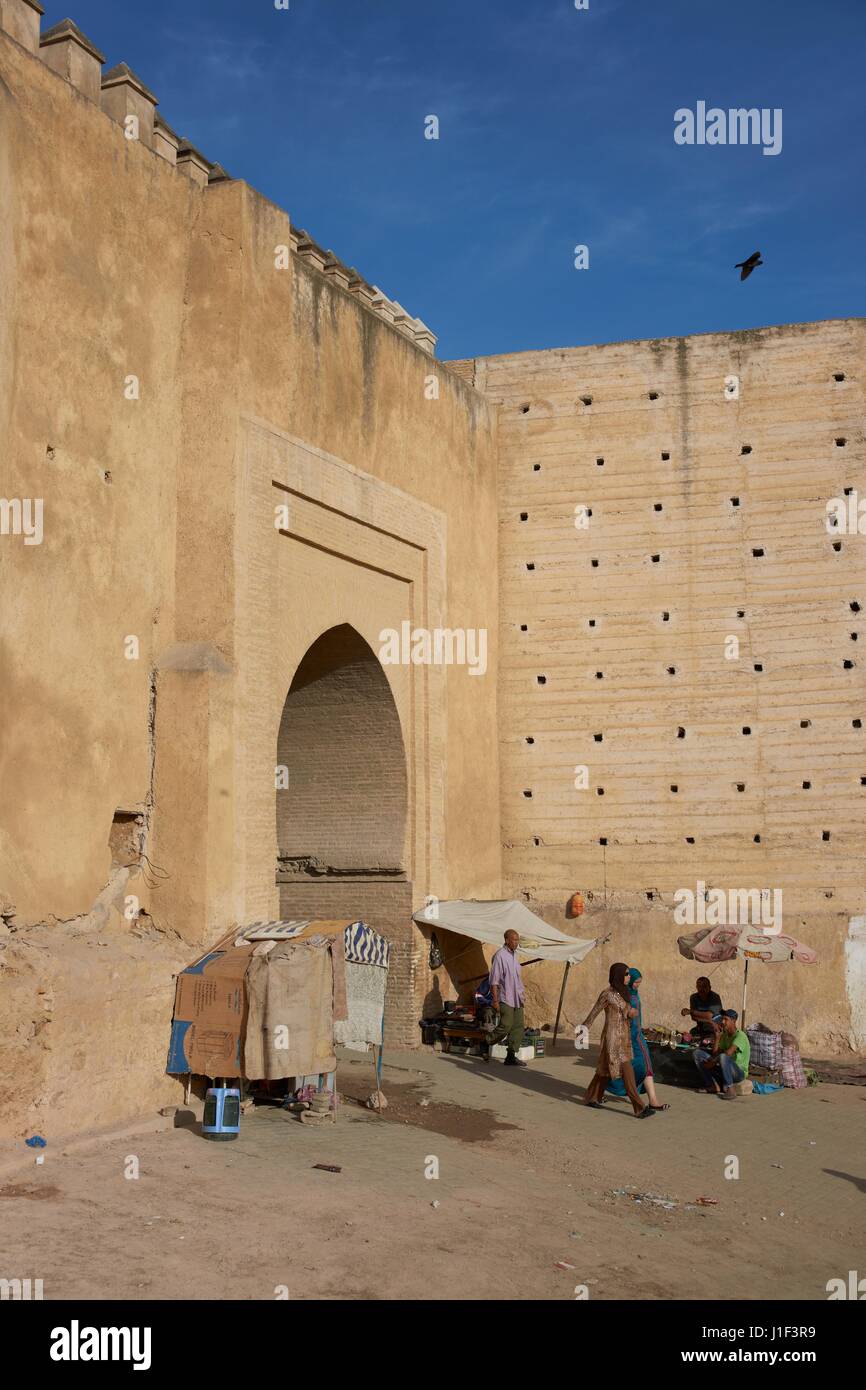 People entering into the ancient walled city of Fes in Morocco, North ...