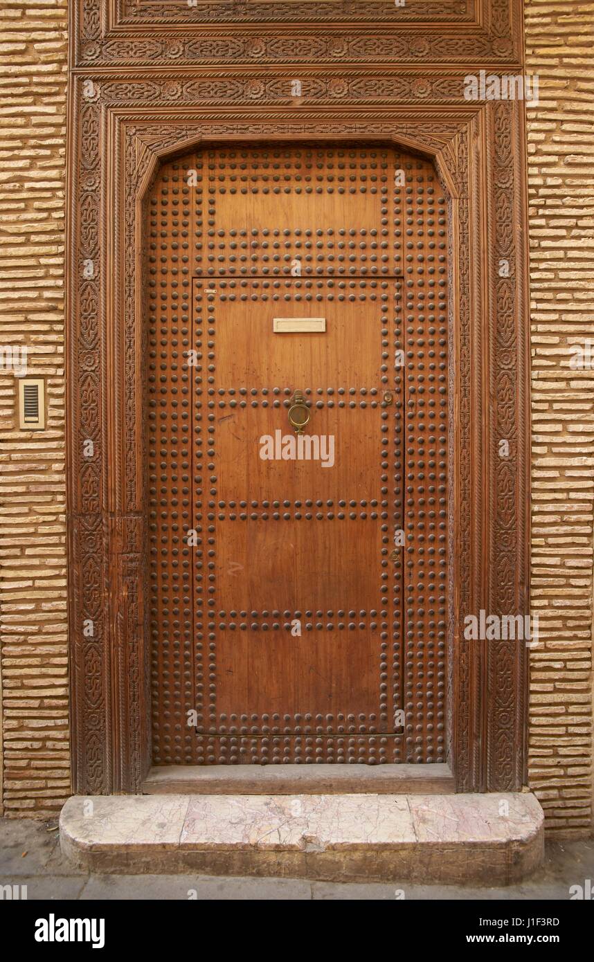 Studded wooden door to a historic Riad in the ancient city of Fes in ...