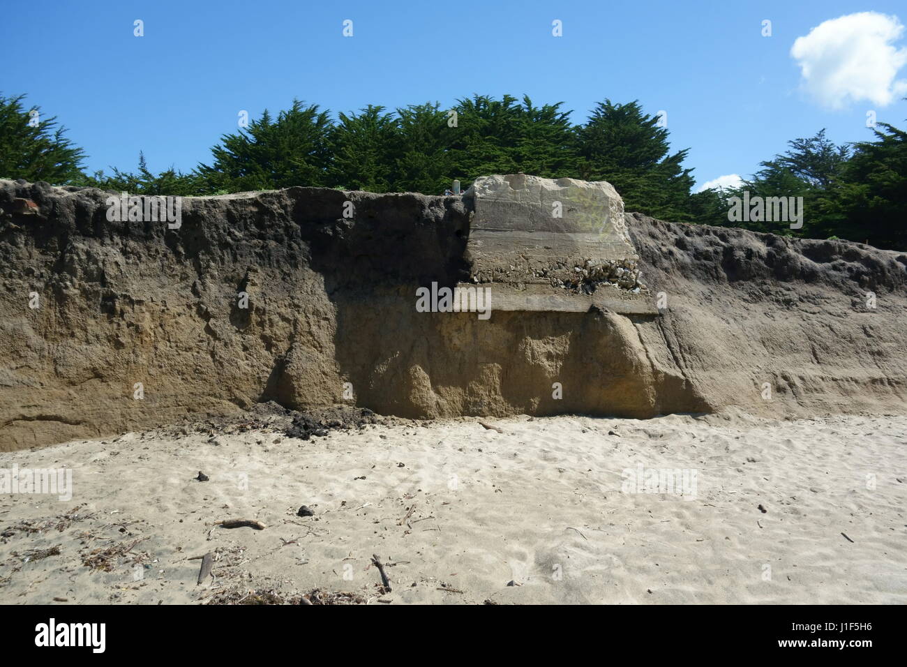 Beach Erosion Reveals Building Foundation Stock Photo - Alamy