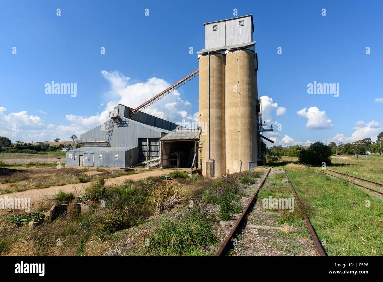 Old grain silo and railroad tracks Stock Photo - Alamy