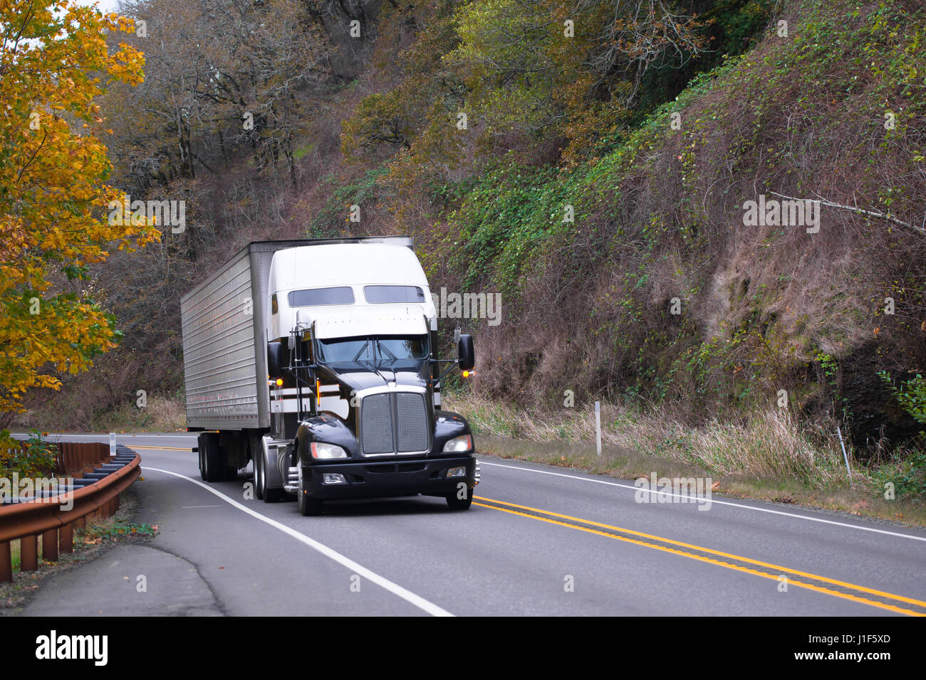 Black vehicle on hilly road hi-res stock photography and images - Alamy