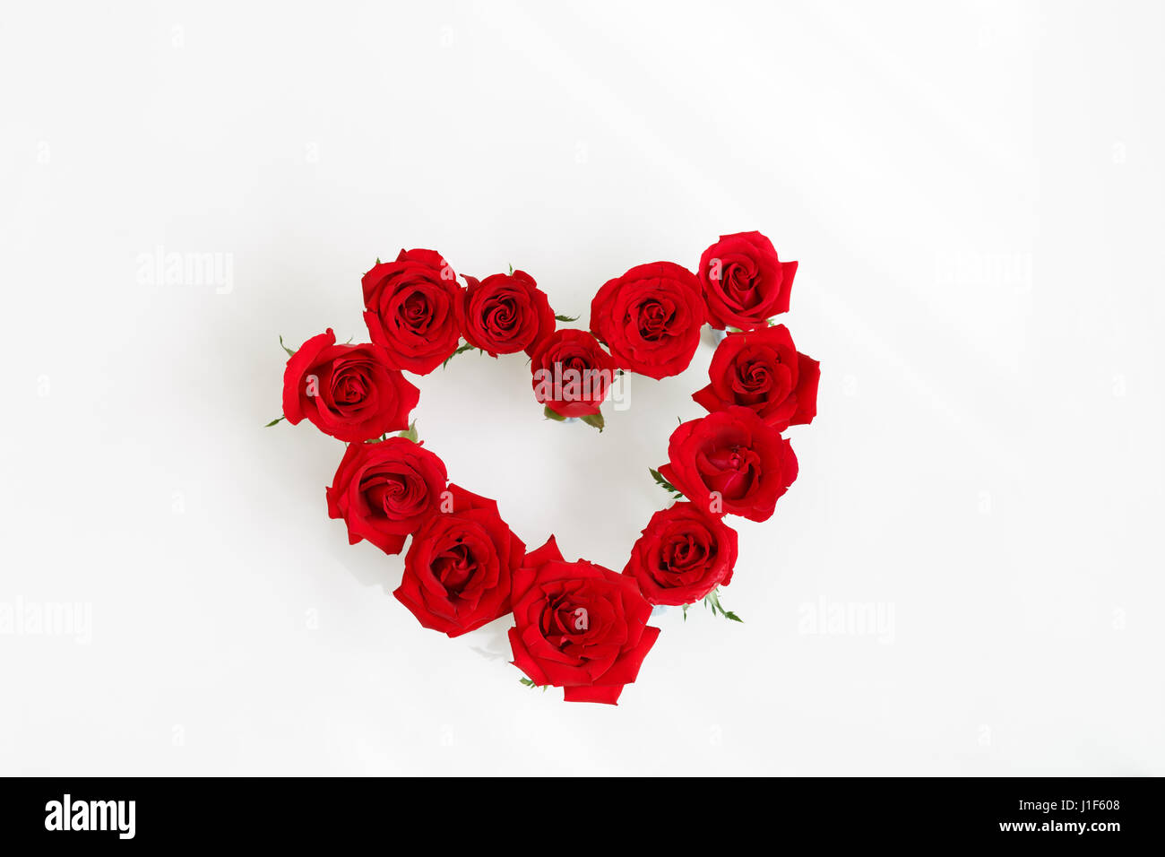 Heart Shaped Red Rose Arrangement on a White Background Stock Photo - Alamy