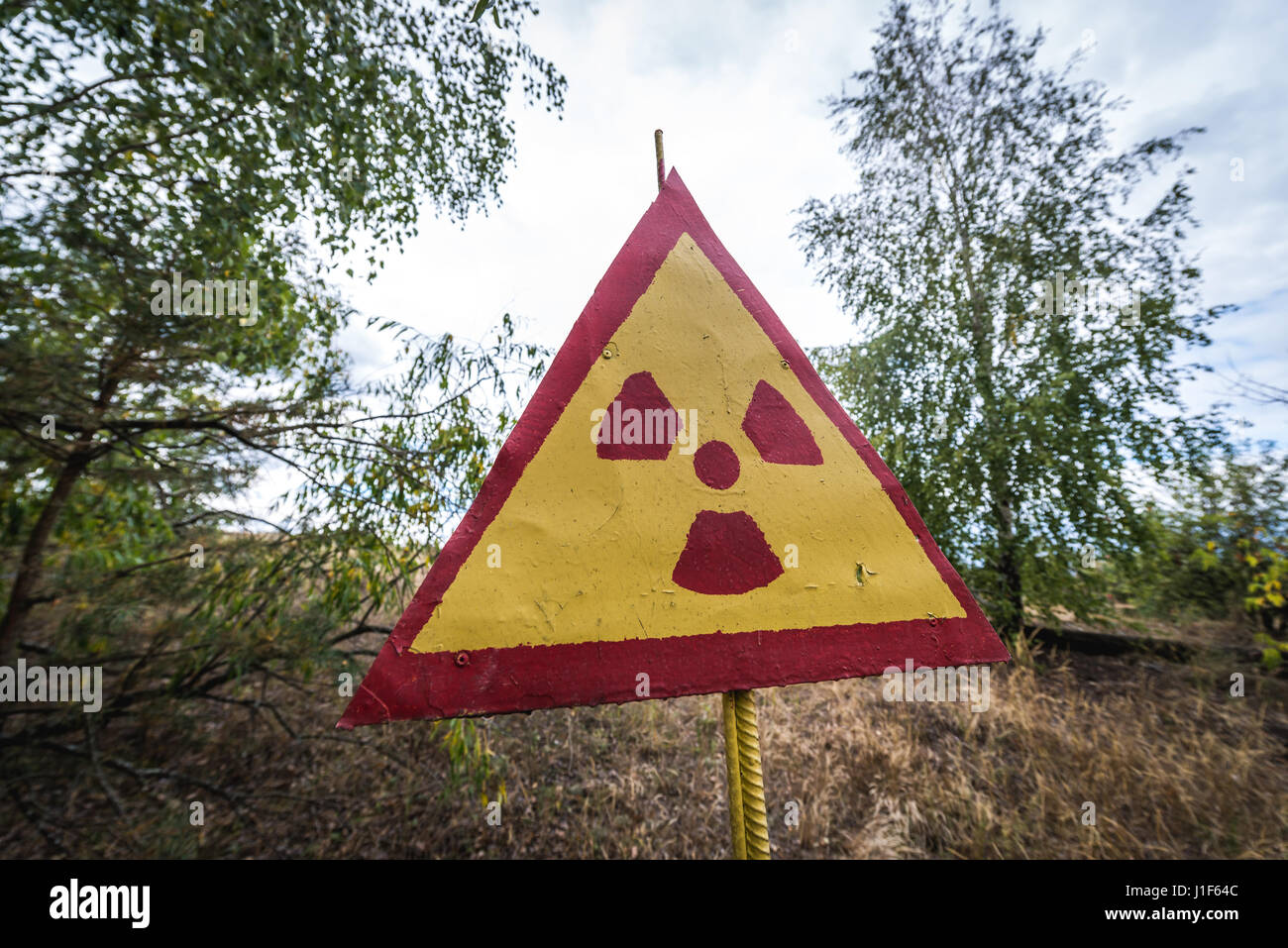 Ionising radiation warning sign on a cemetery in Pripyat ghost city of ...