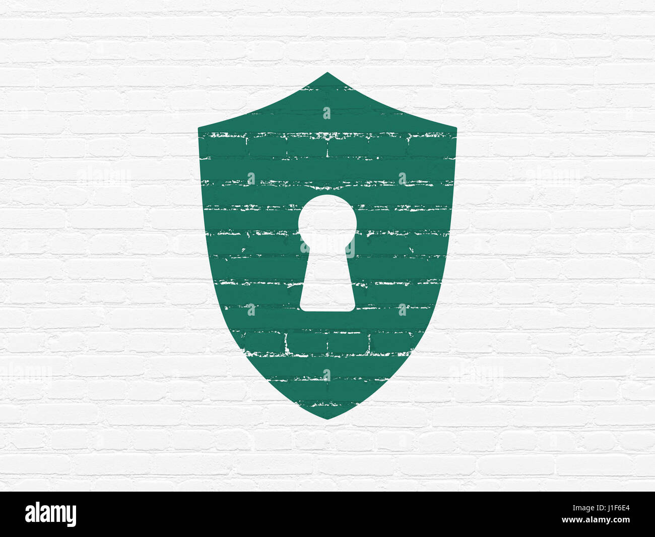 Safety concept: Shield With Keyhole on wall background Stock Photo - Alamy