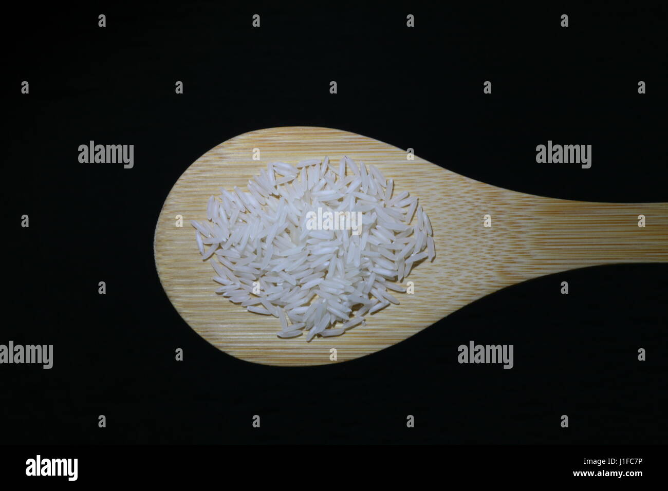 basmati rice on wooden spoon Stock Photo - Alamy