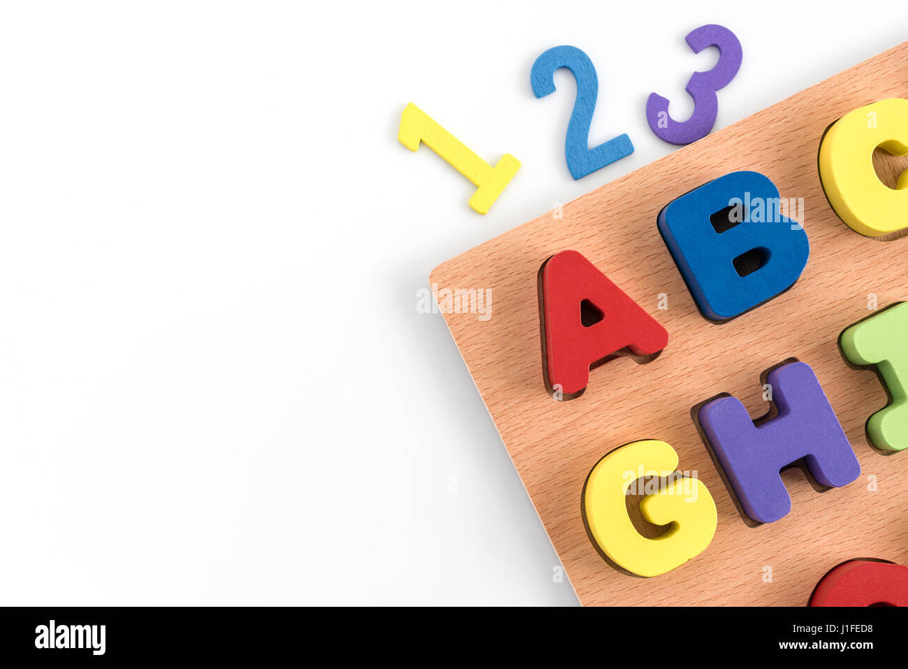 Colorful wood alphabet letters and number (1 2 3) isolated on white ...