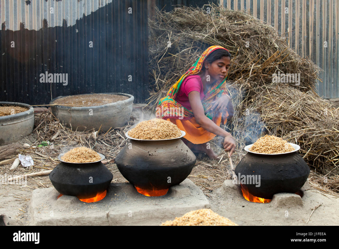 People boiling rice hi-res stock photography and images - Alamy