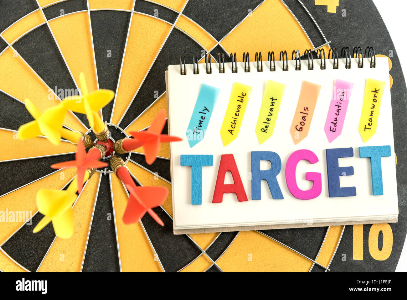 Six Dart In Bullseye With Words Target On The Notebook With Handwriting six-dart-in-bullseye-with-words-target-on-the-notebook-with-handwriting