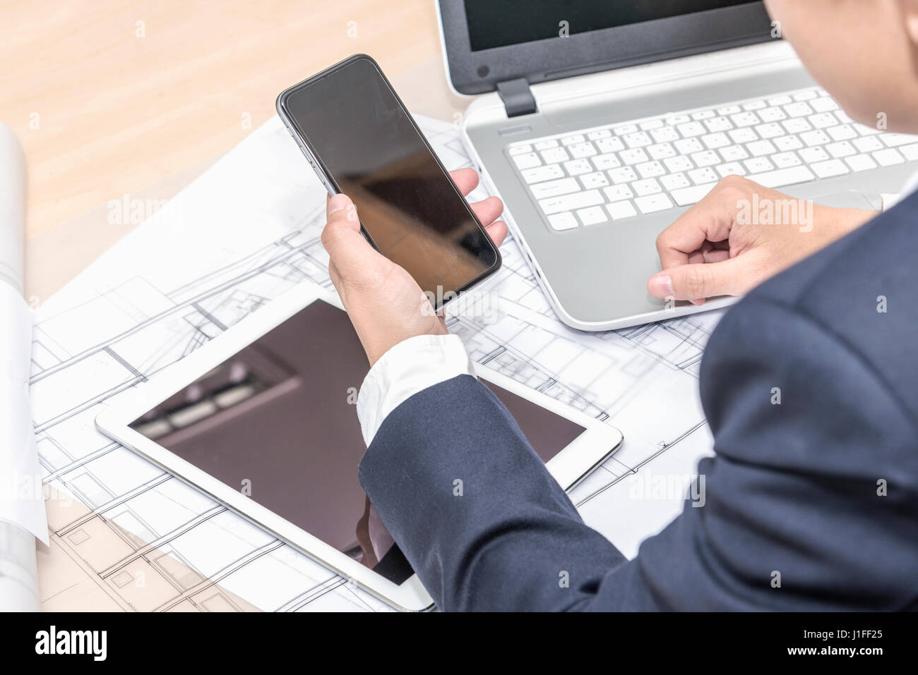close up of businessman holding smartphone with black screen over ...