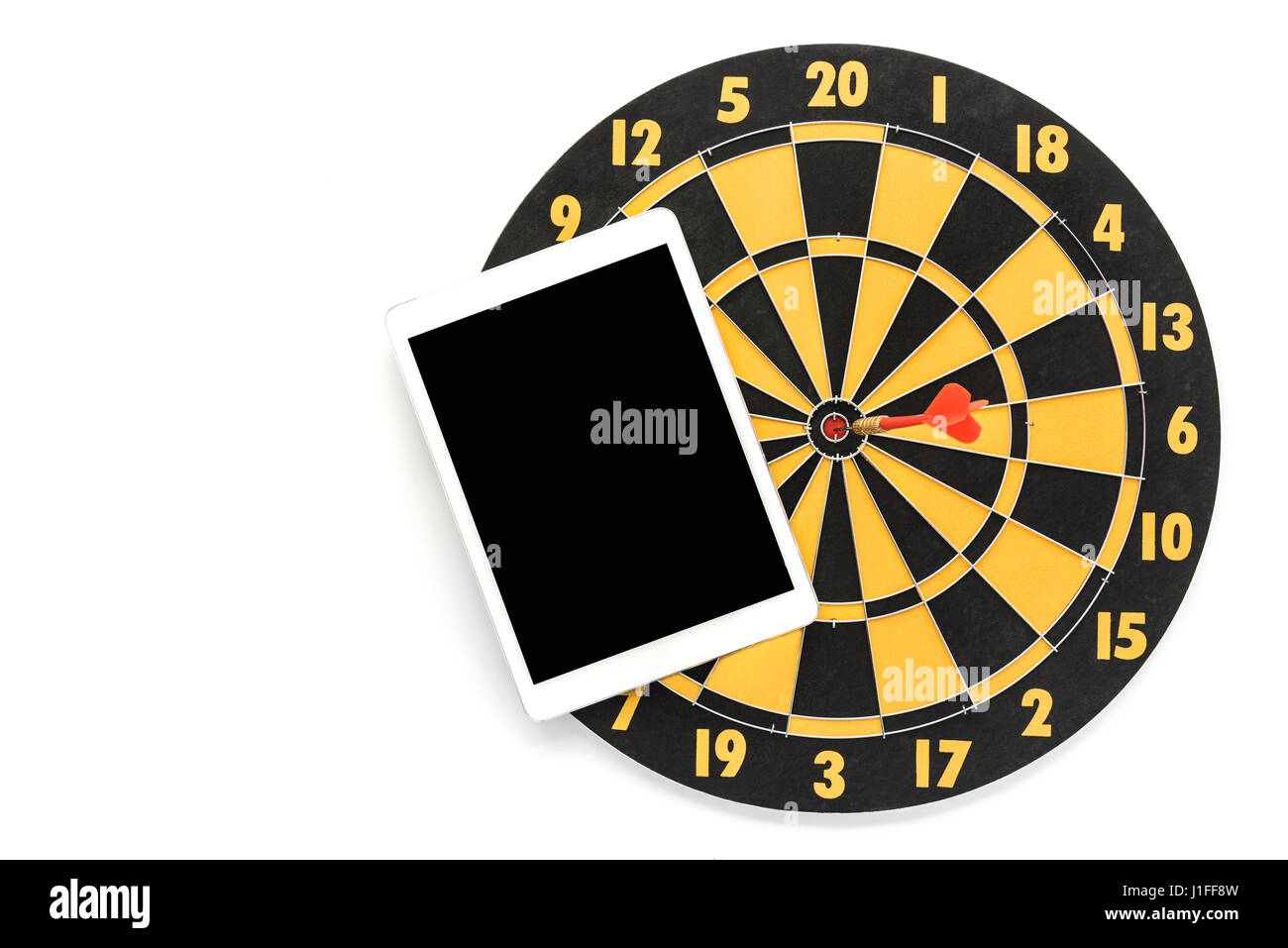 dart target on bullseye with blank black screen tablet on white ...