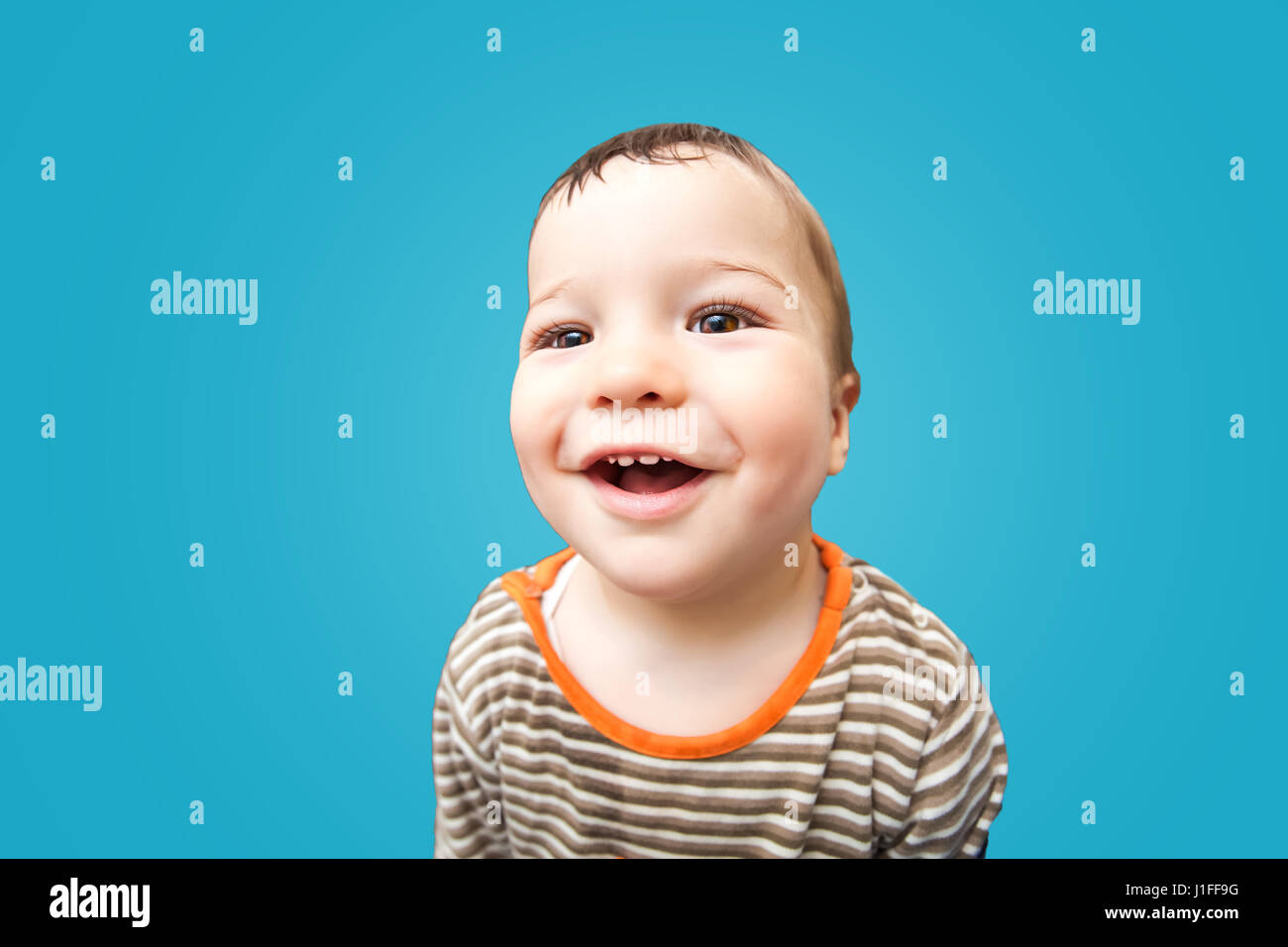 close-up portrait of little cute baby with big cheeks and beautiful ...