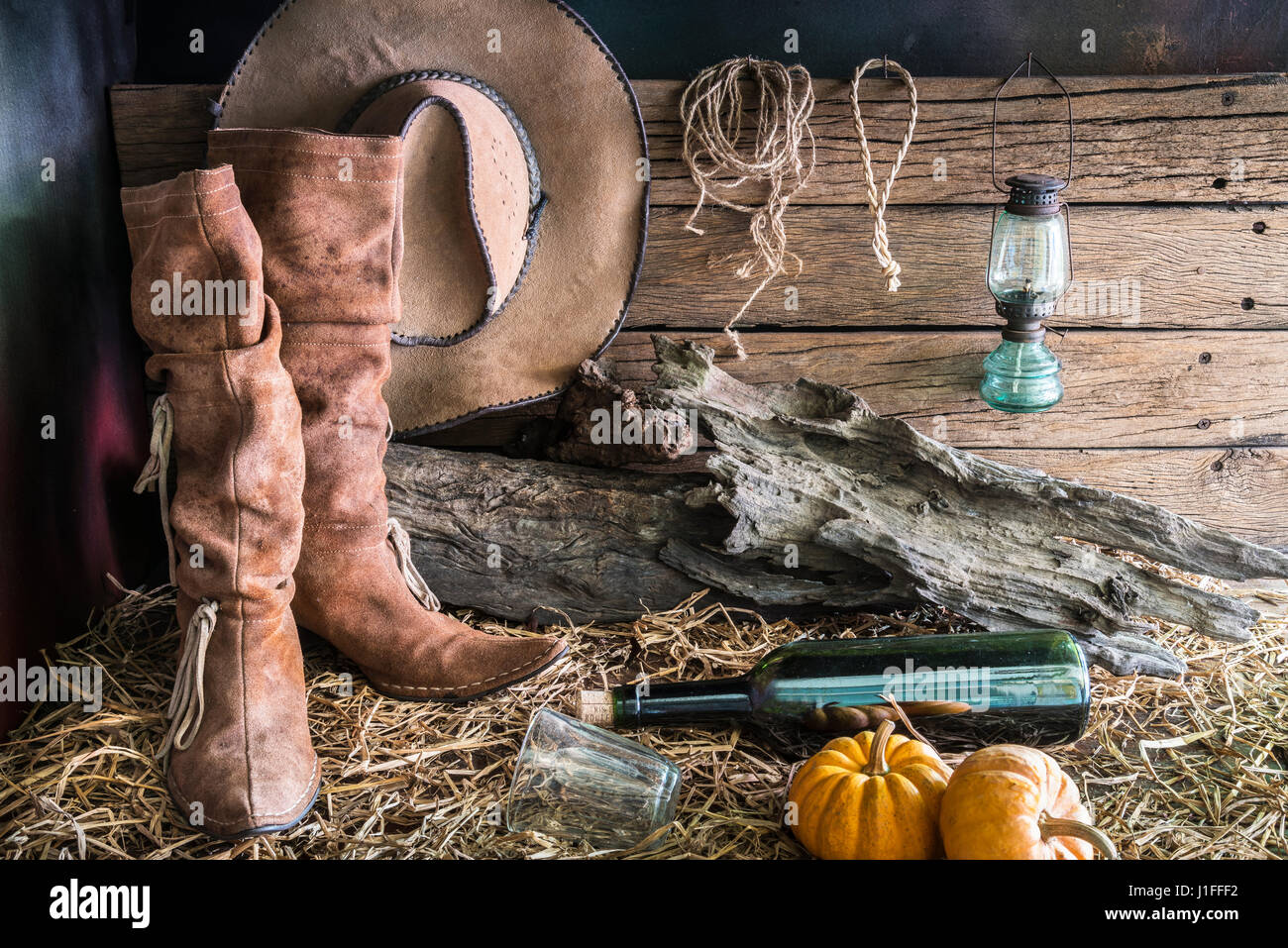 Still life photography with traditional leather boots and american west ...