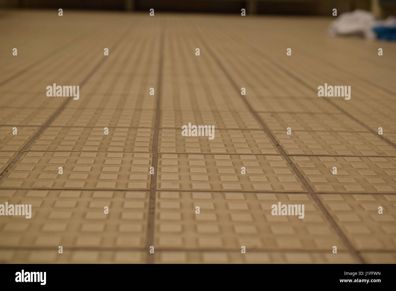 Closeup of square tiles in locker room Stock Photo - Alamy