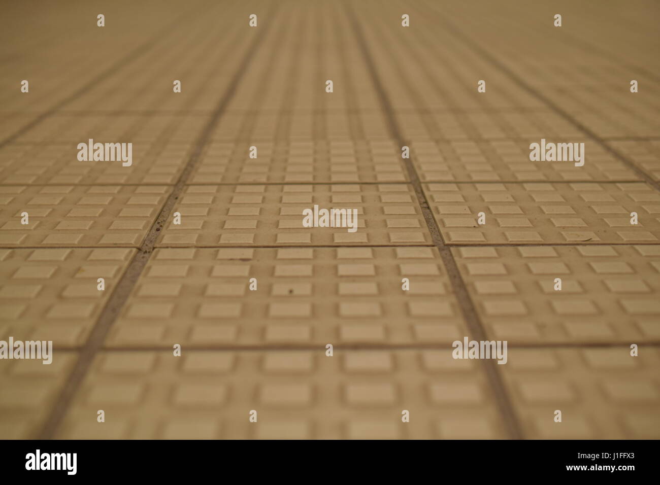 Closeup of square tiles in locker room Stock Photo - Alamy