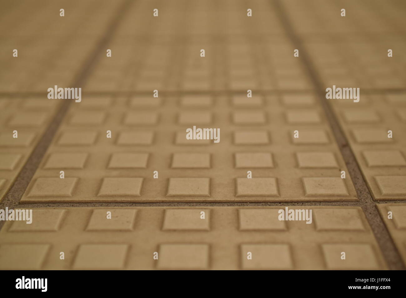 Closeup of square tiles in locker room Stock Photo - Alamy