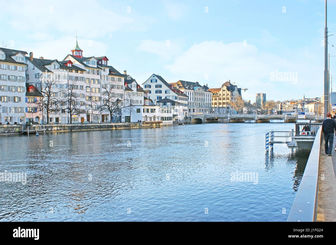 ZURICH, SWITZERLAND - MARCH 20, 2011: The walk on Limmat quay with a ...