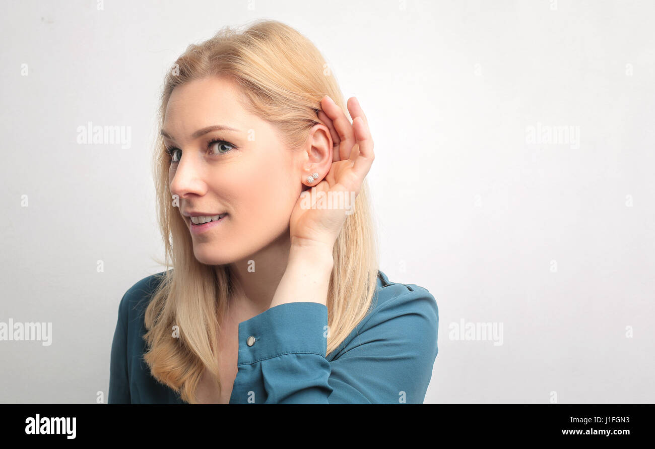 Woman trying to catch some gossip Stock Photo - Alamy