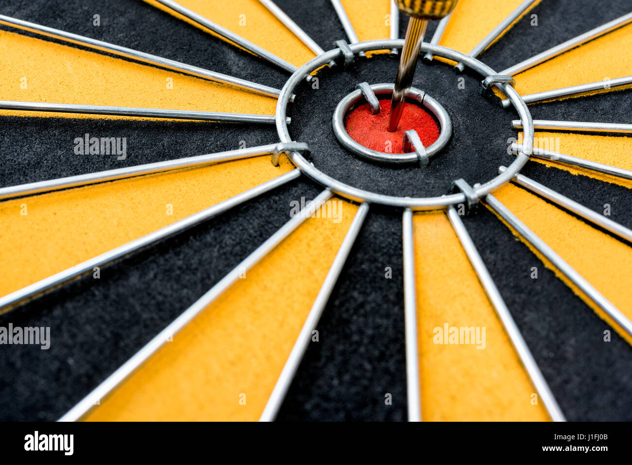 Closeup dart target with arrow on the center of dartboard, Goal target ...
