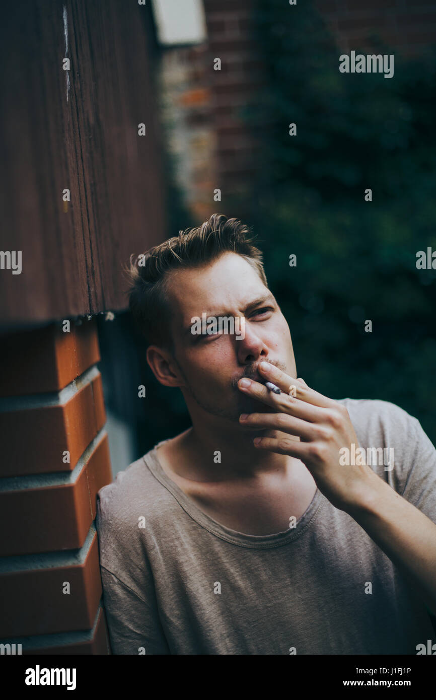 Leaning smoker High Resolution Stock Photography and Images - Alamy