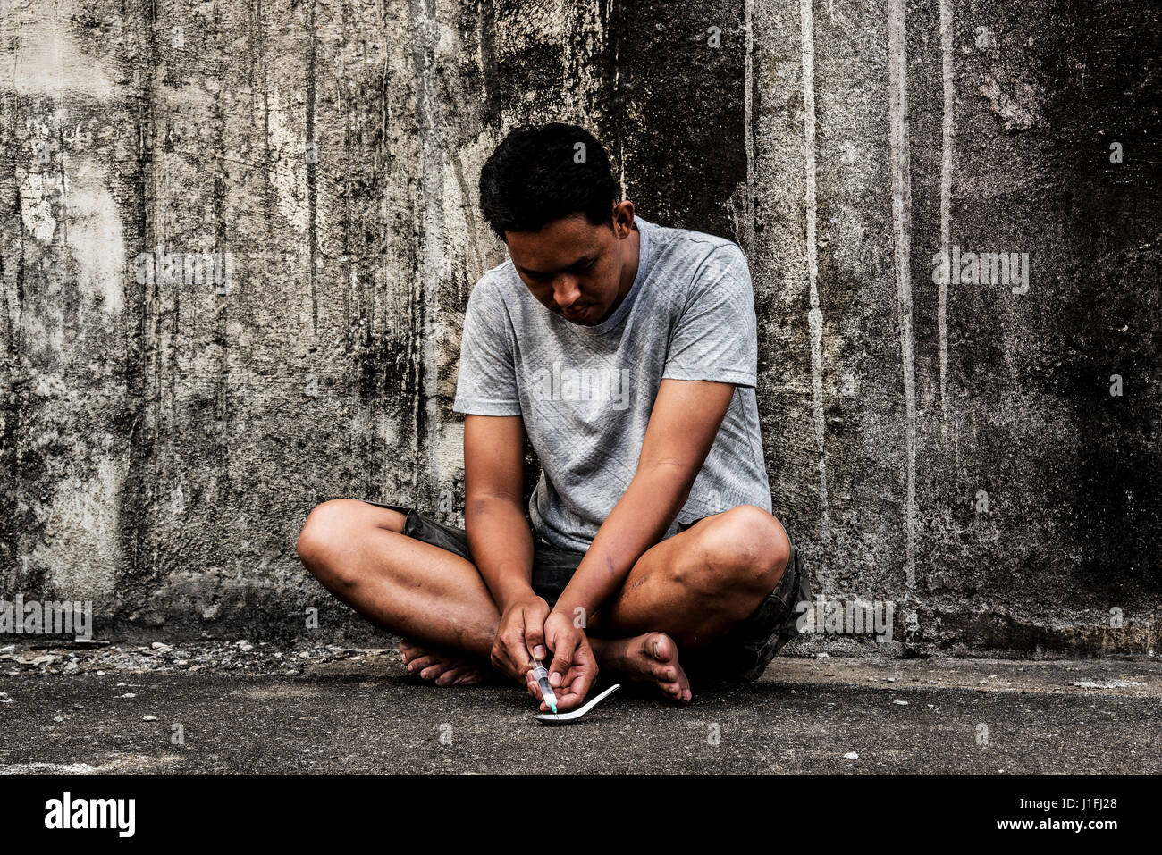 asian male drugs narcotic syringe in action with copy space, drugs ...