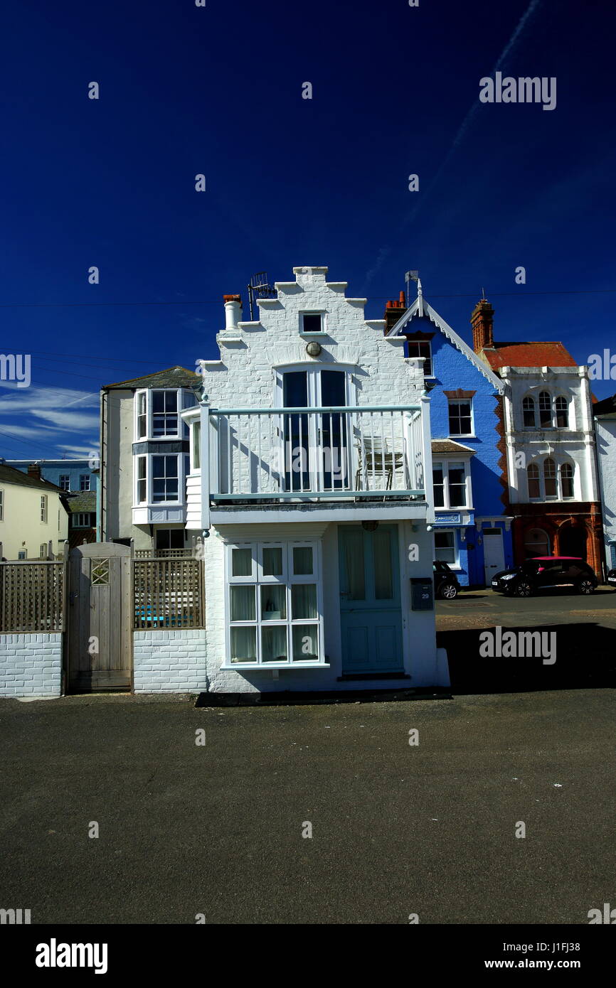small house on sea front at Aldeburgh Suffolk in sunshine and blue sky ...