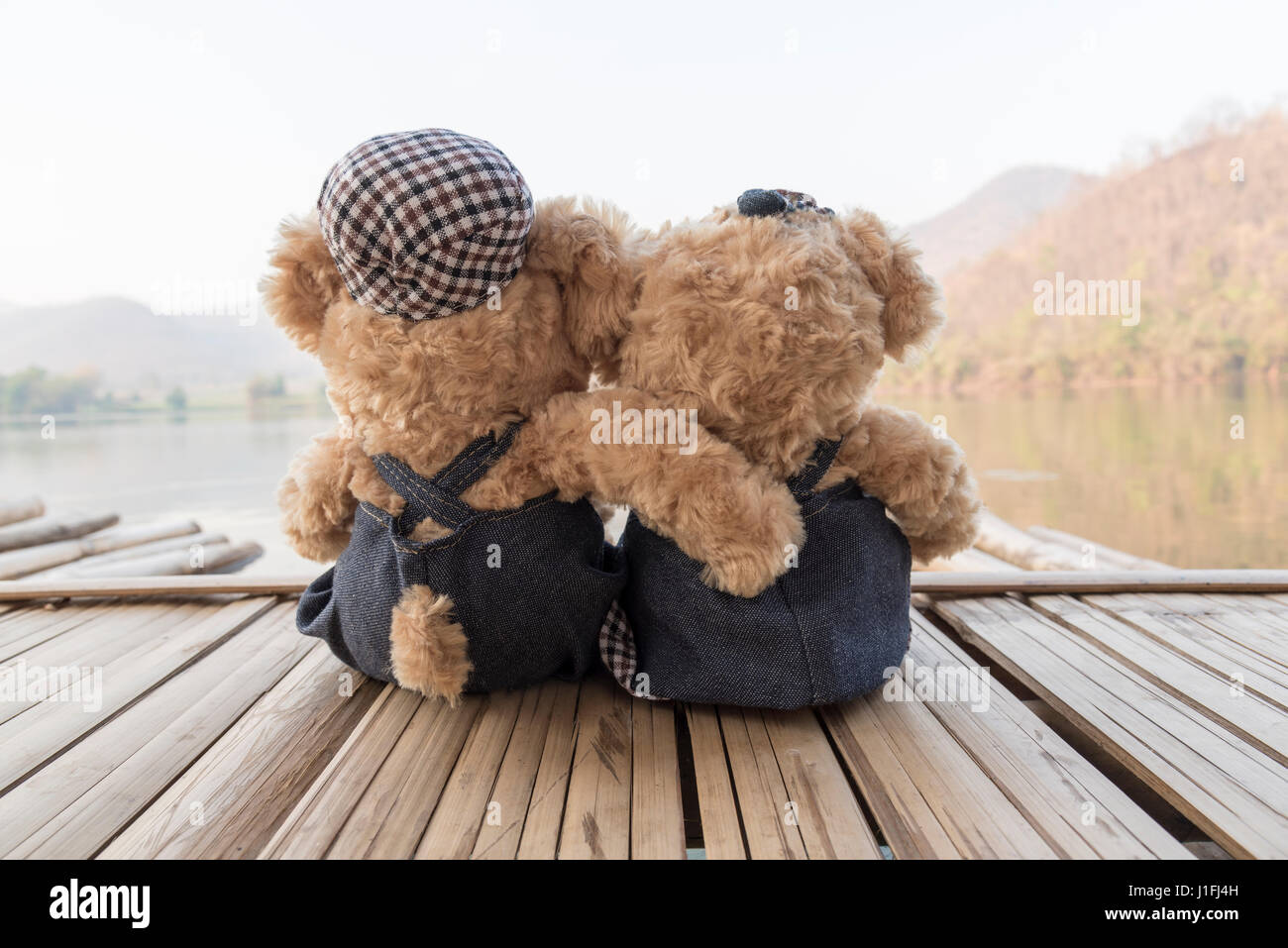 couple teddy bears picnic in raft floating on the river, love concept ...