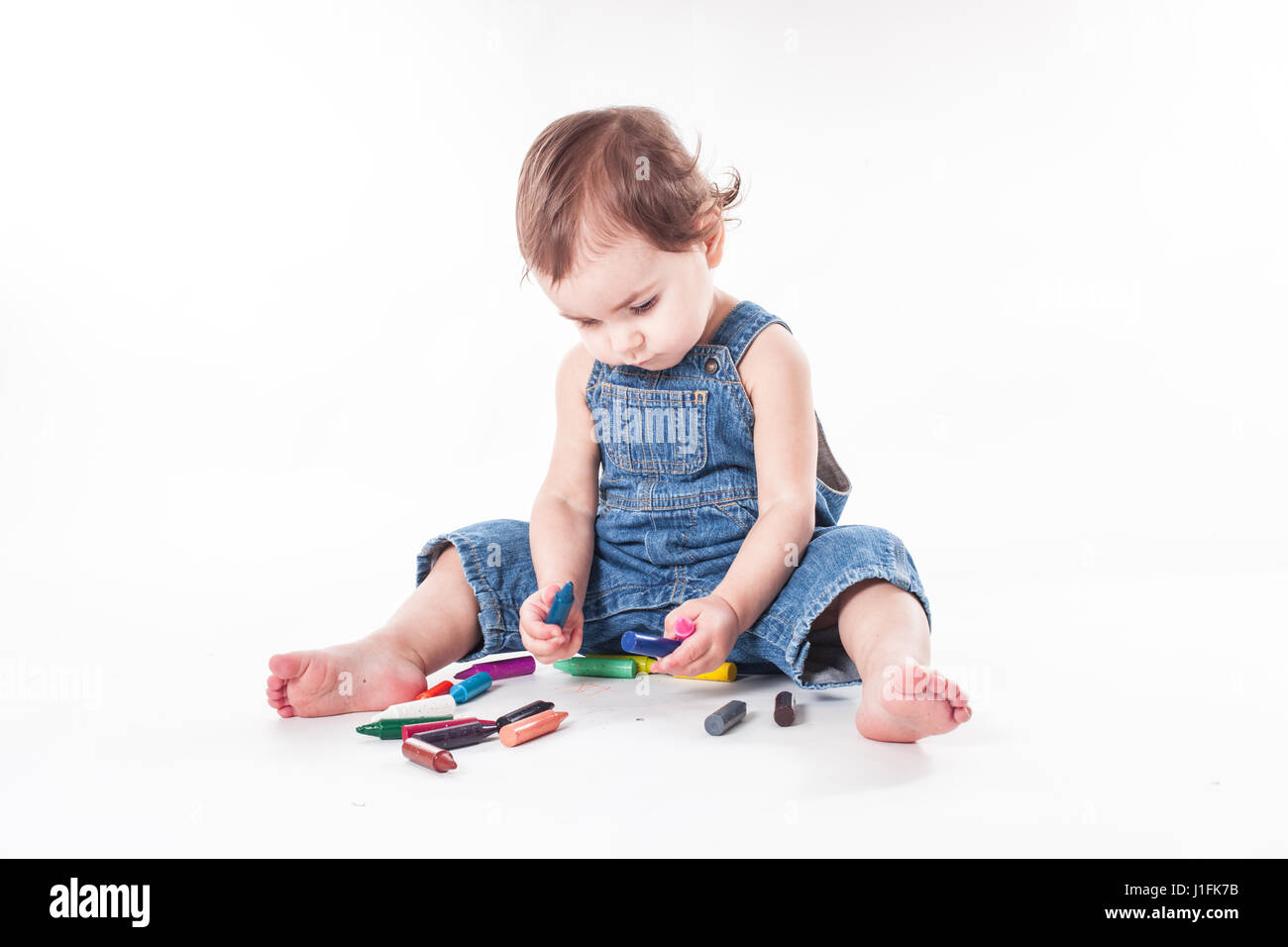 Baby girl is writting Stock Photo - Alamy