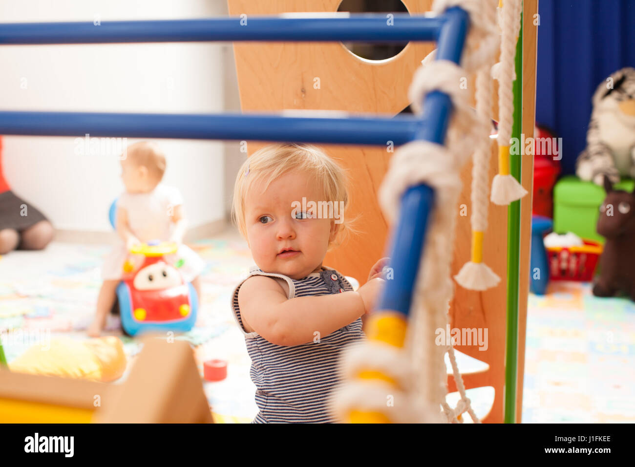 The baby playing on the playground Stock Photo - Alamy