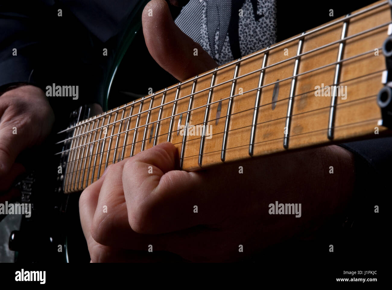 man playing guitar body only no face see neck and body of guitar Stock ...