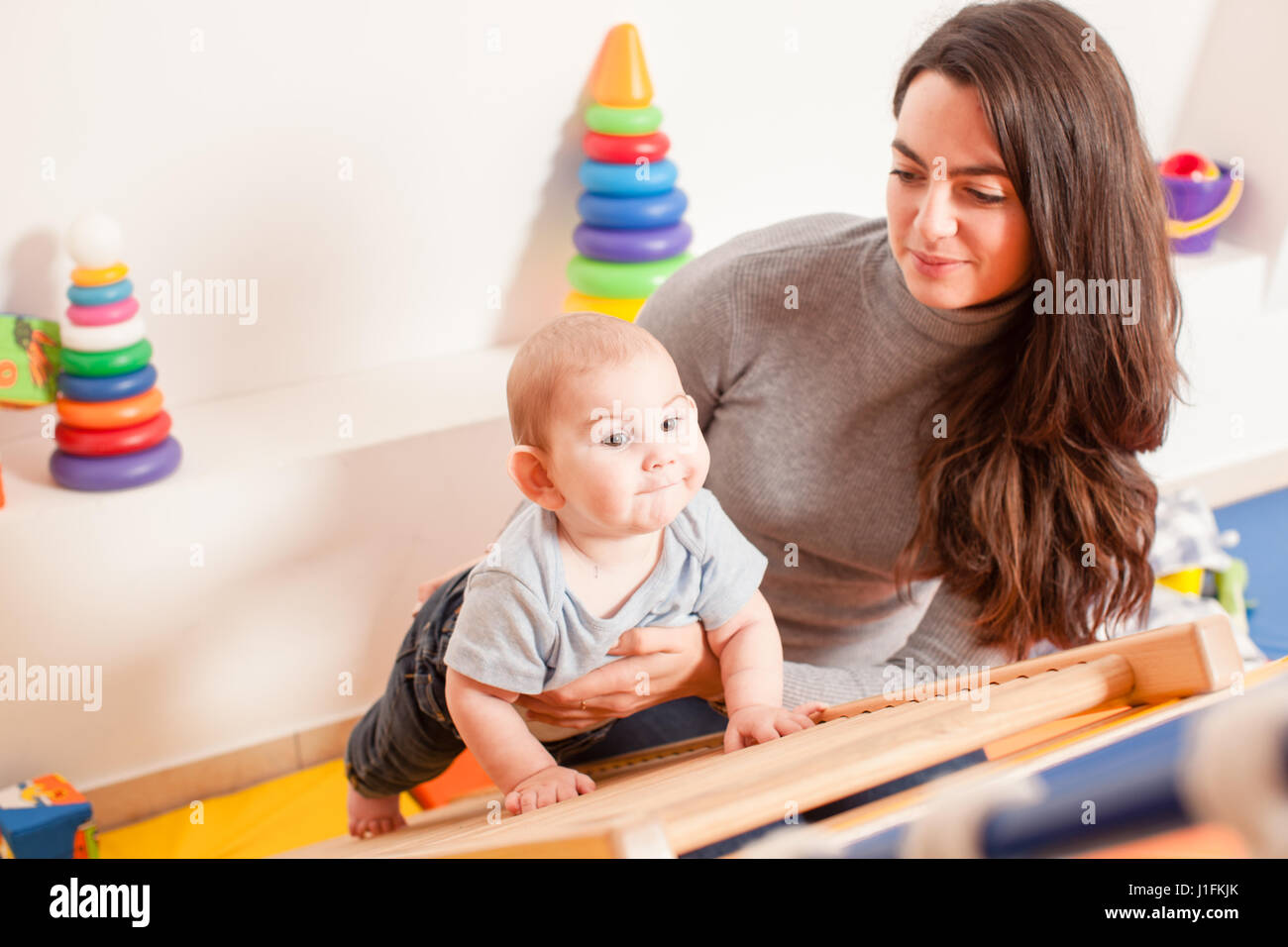 Interaction between mother and baby Stock Photo - Alamy